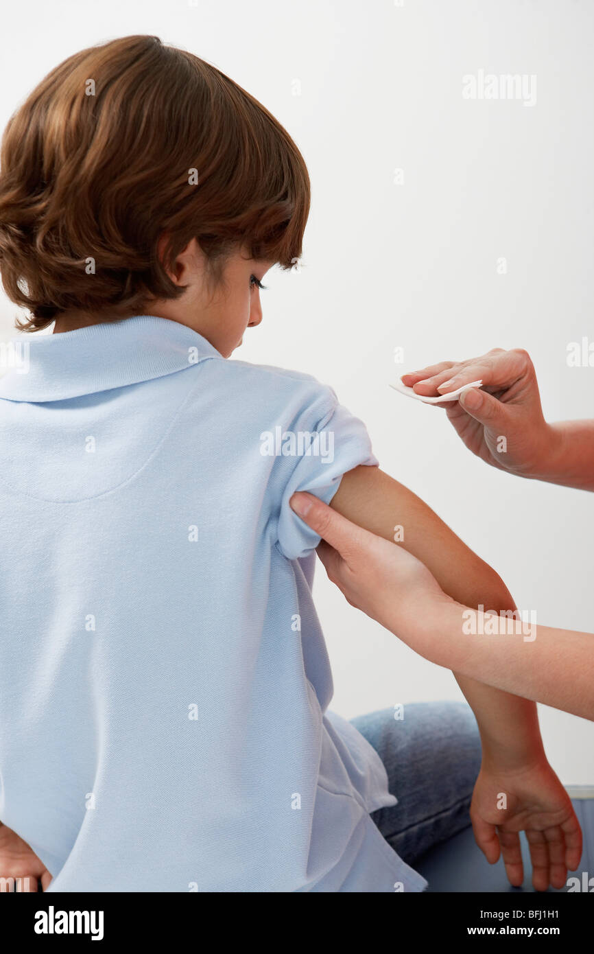 Boy being prepared to receive injection Stock Photo - Alamy