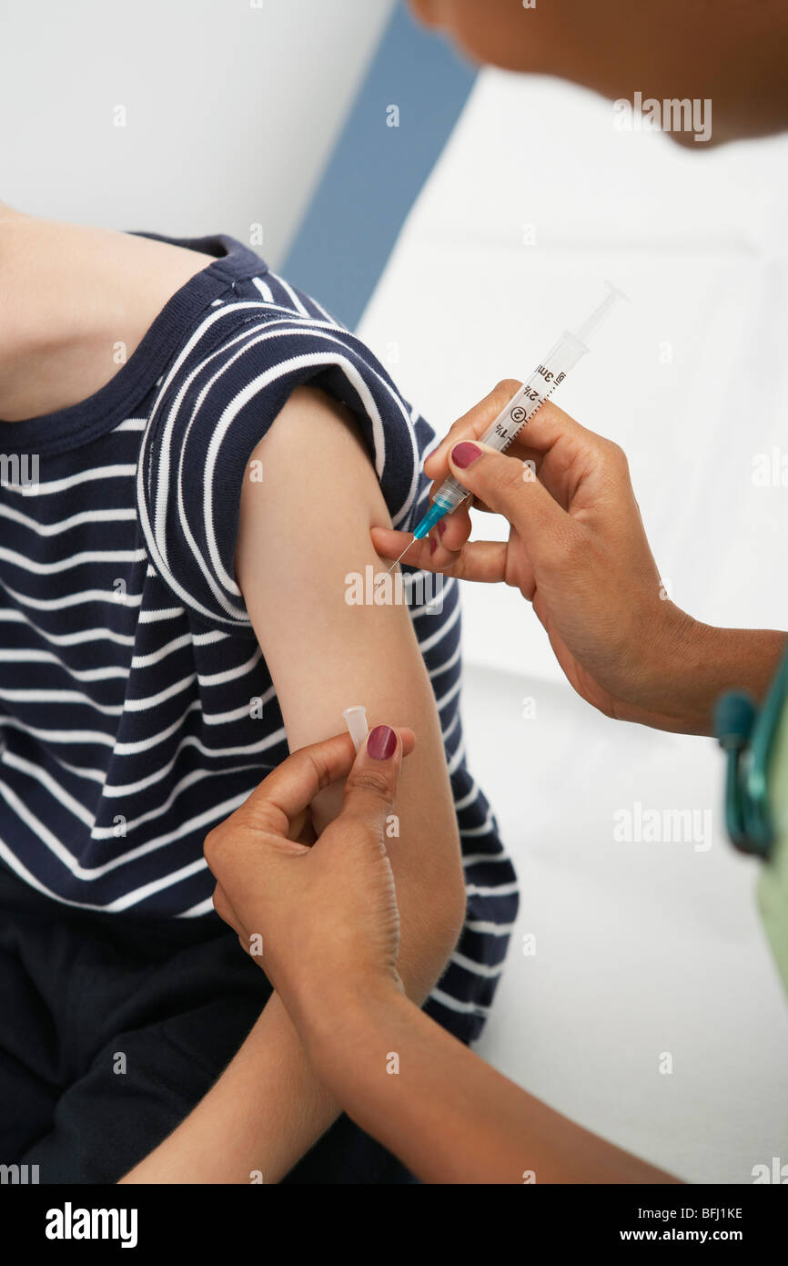 Boy receiving injection Stock Photo - Alamy