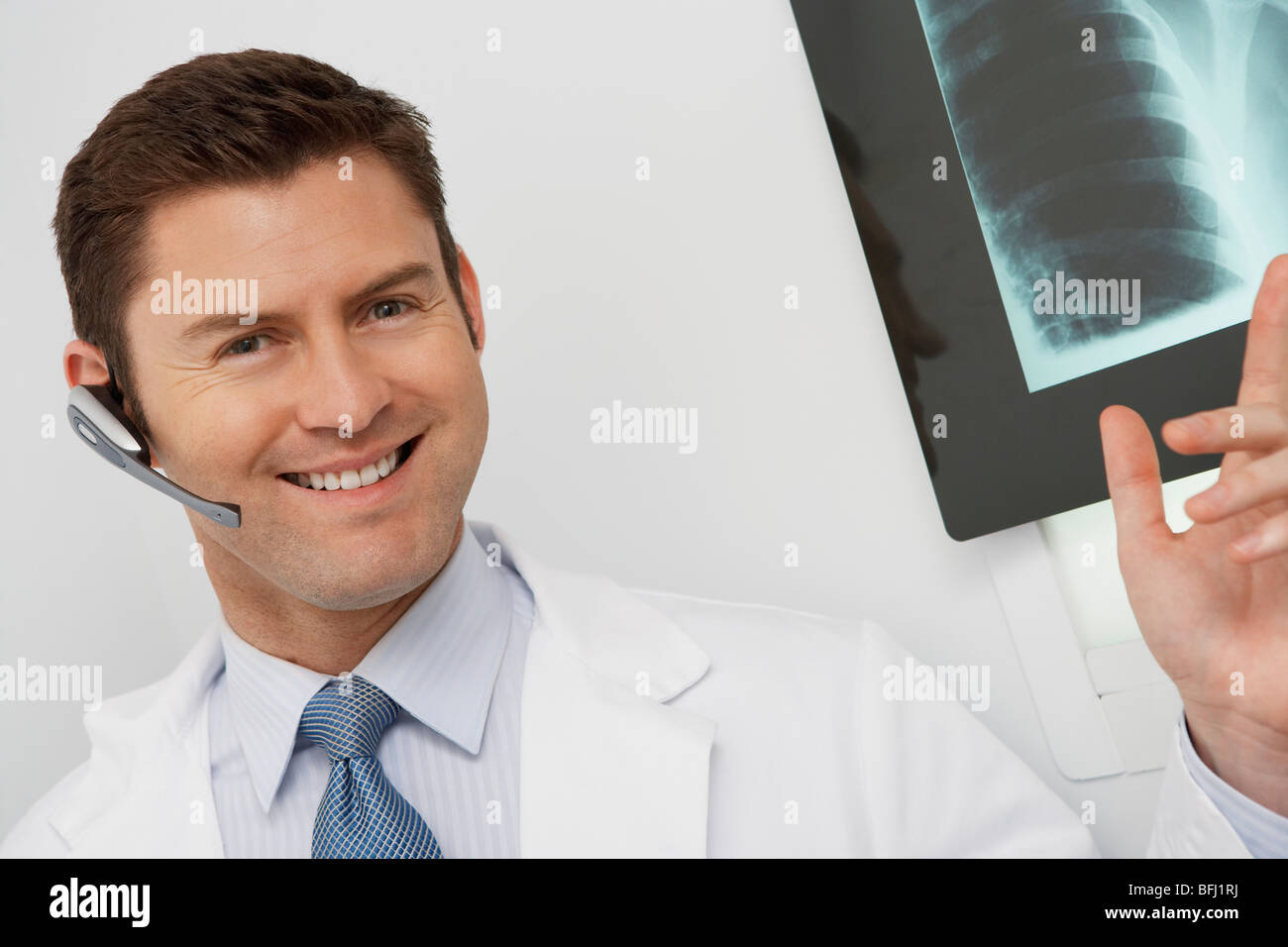 Doctor holding x-ray in hospital,portrait Stock Photo - Alamy