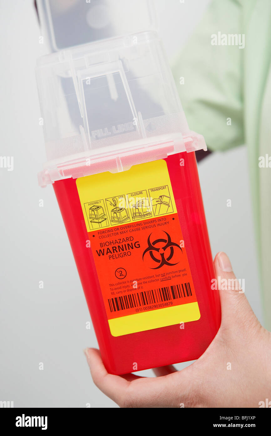 Doctor holding medical container in hospital,close-up Stock Photo - Alamy