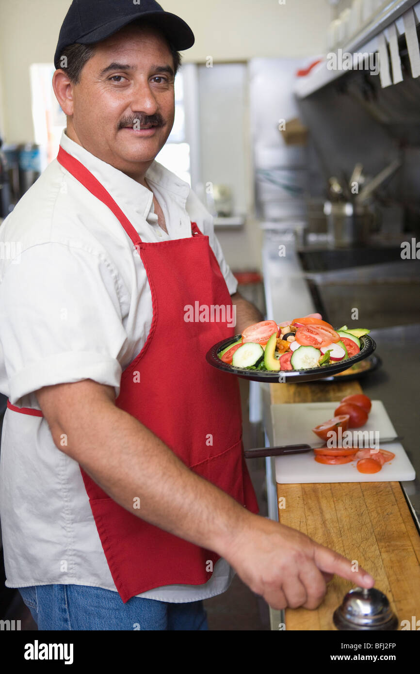 Portrait of man working in restaurant kitchen Stock Photo - Alamy