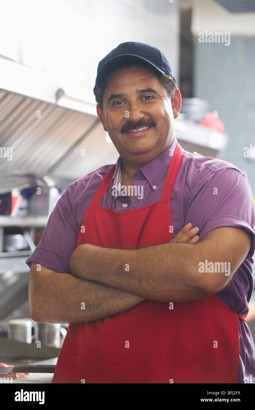 Portrait of man in restaurant kitchen Stock Photo - Alamy