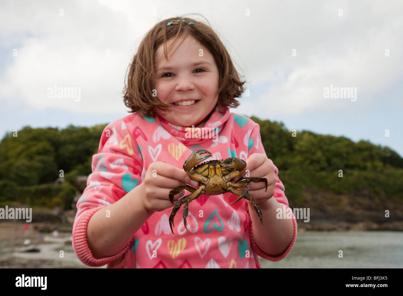 Crabbing girl looking at caught crab hi-res stock photography and ...