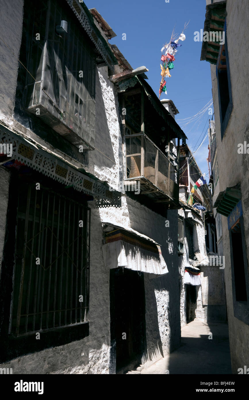 old town area of lhasa tibet with narrow street prayer flags and ...