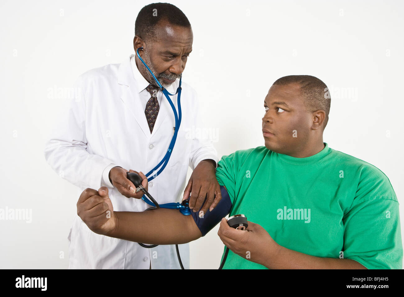 Doctor examining patient Stock Photo - Alamy