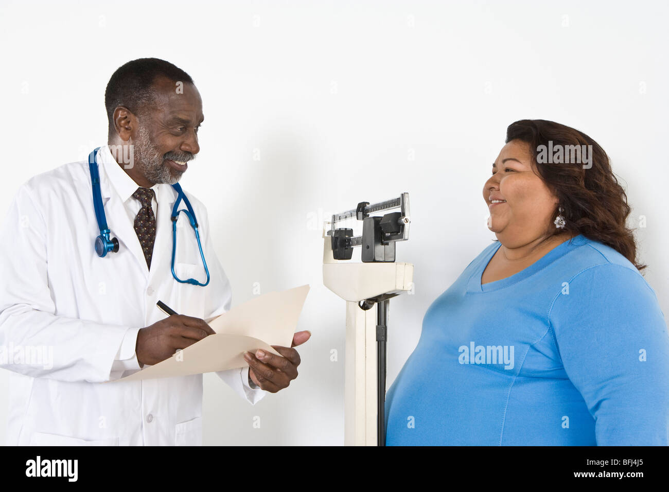 Doctor examining patient Stock Photo - Alamy