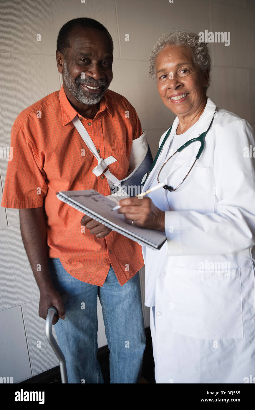 Doctor with patient Stock Photo - Alamy