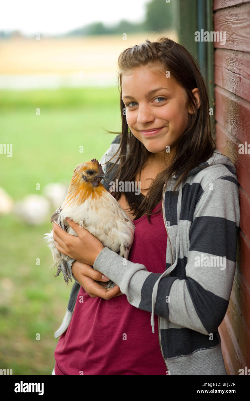 Girl carrying hen hi-res stock photography and images - Alamy