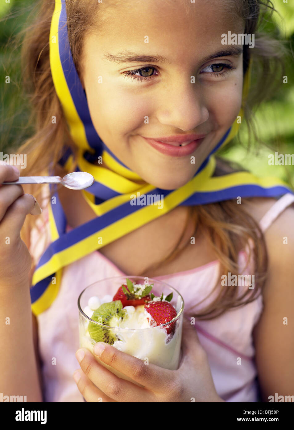 A girl eating a dessert, Sweden Stock Photo - Alamy