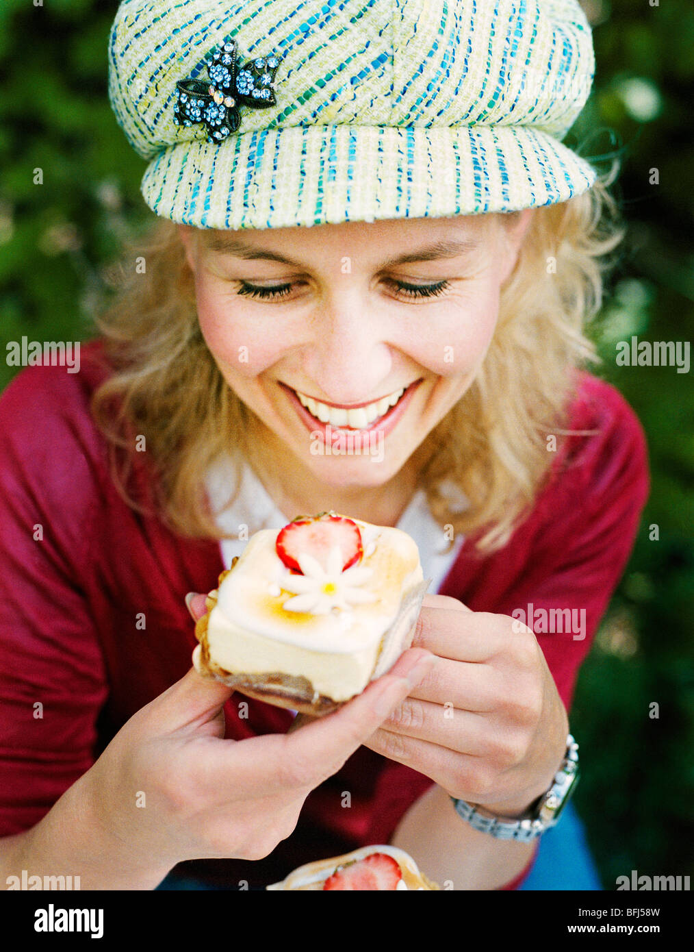 A woman enjoying a pastry, Sweden Stock Photo - Alamy