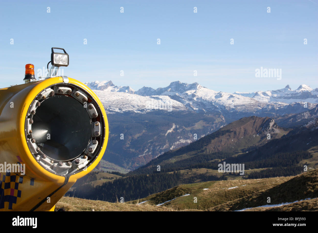 Snow cannon awaiting winter. A snow cannon in an alpine setting in the ...