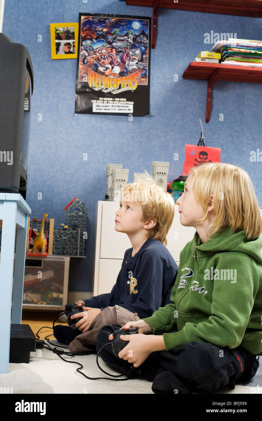 Two Scandinavian boys playing video games, Sweden Stock Photo - Alamy