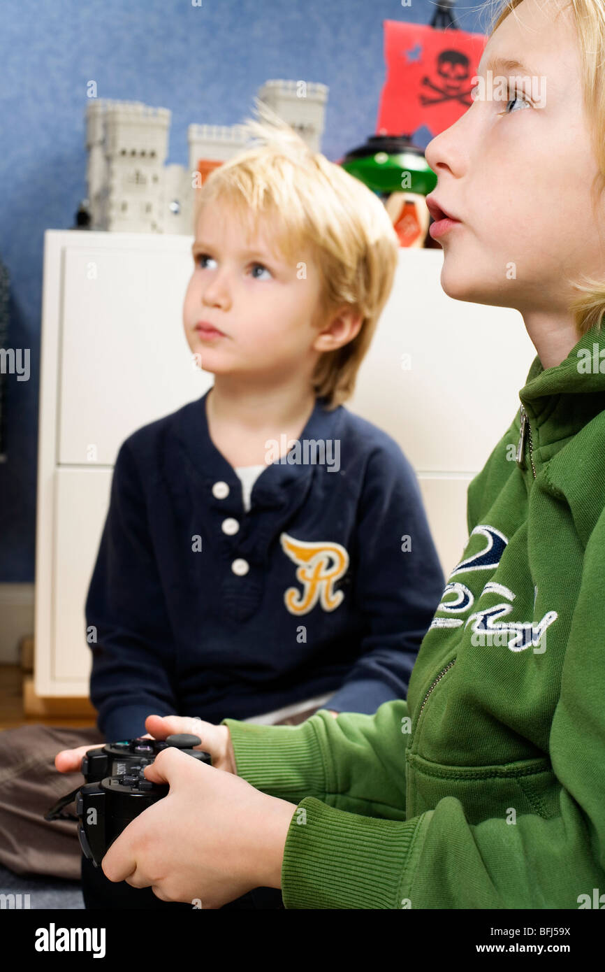 Two Scandinavian boys playing video games, Sweden Stock Photo - Alamy