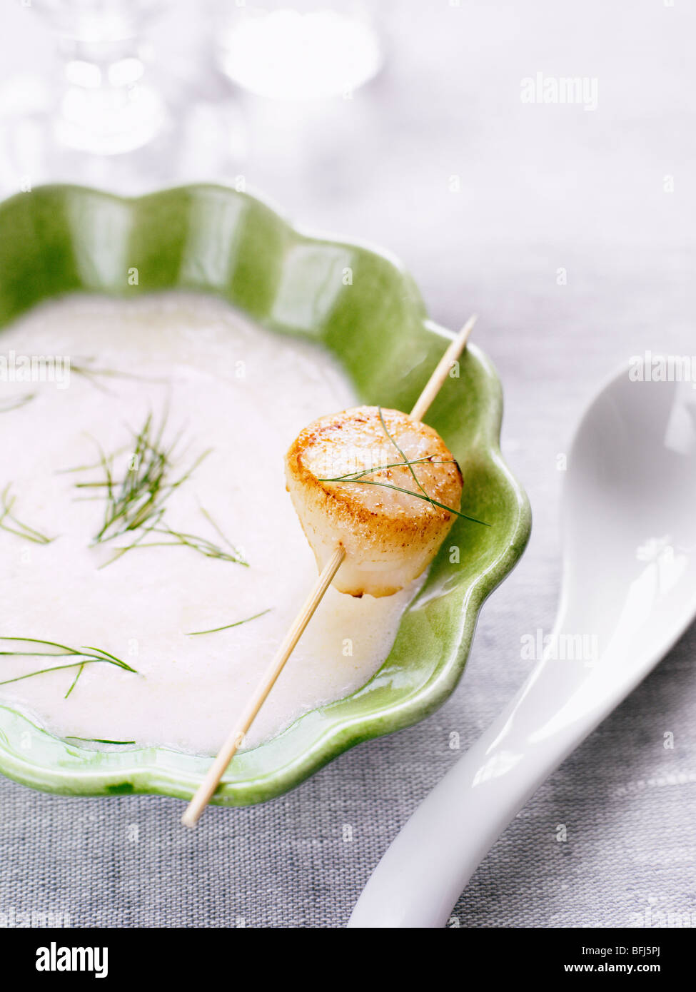 Scallop Saint-Jacques and soup Stock Photo - Alamy