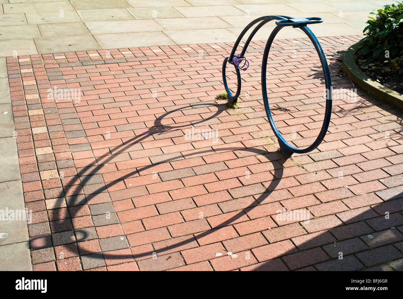 Modern metal cycle rack with shadow Stock Photo - Alamy