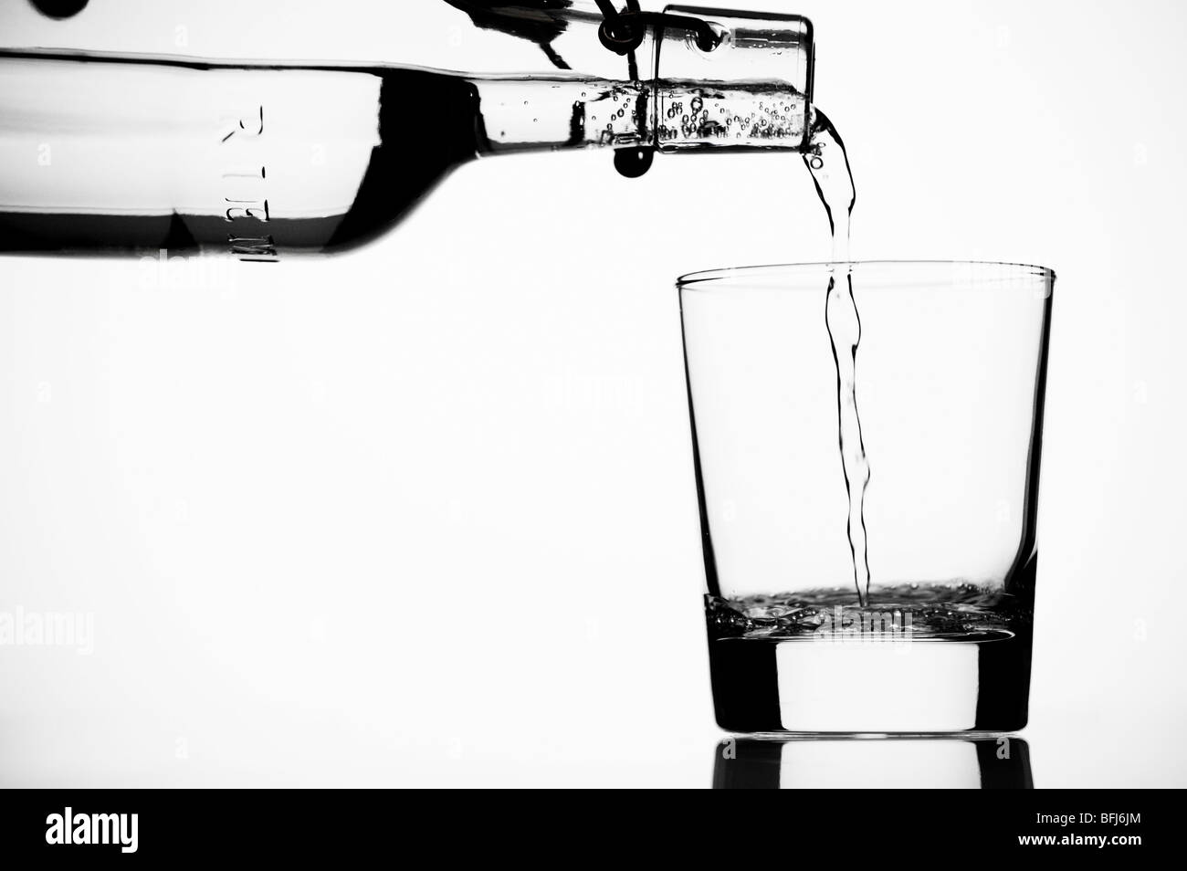 Emptying out a bottle Stock Photo - Alamy