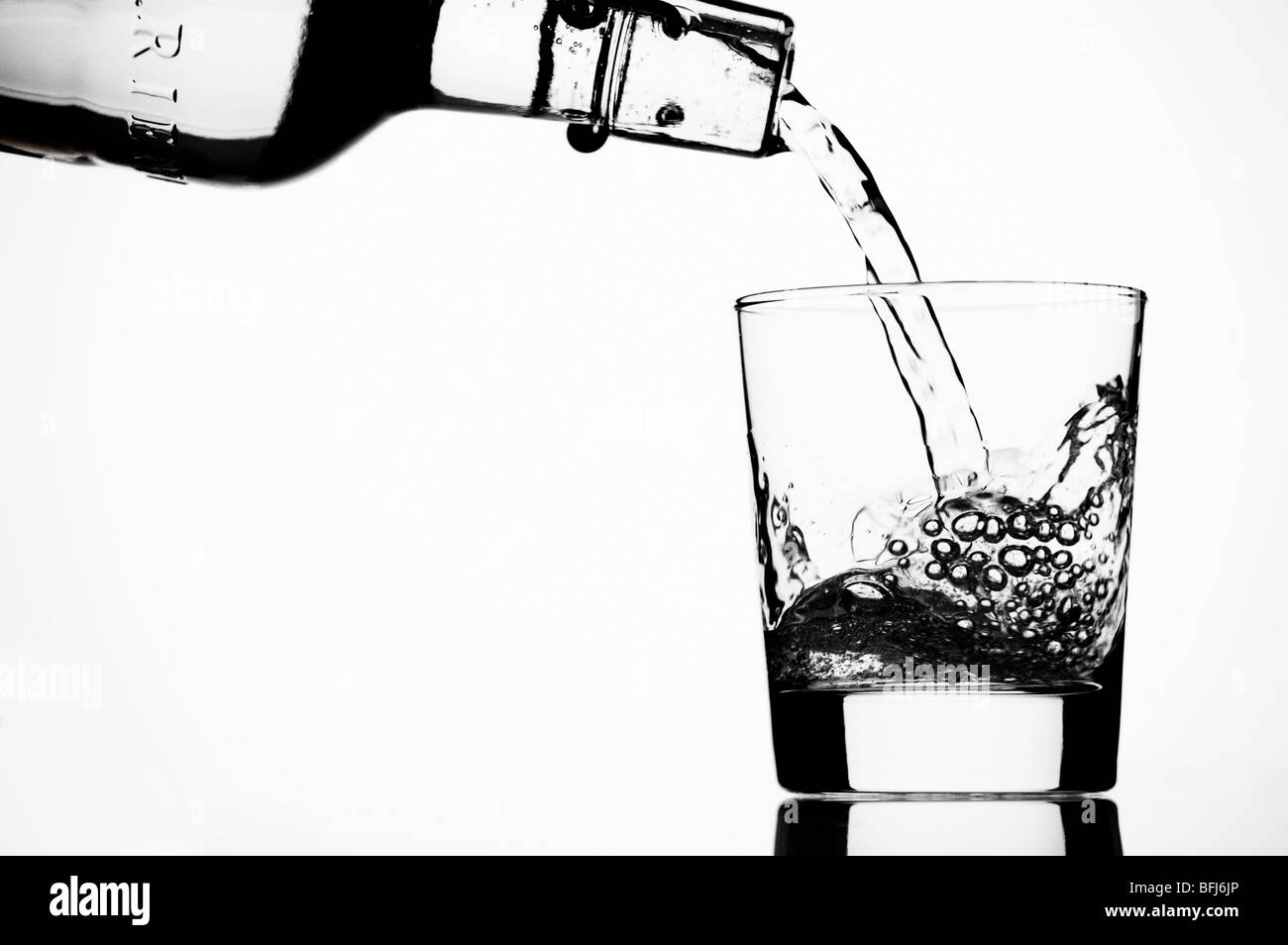 Emptying out a bottle Stock Photo - Alamy