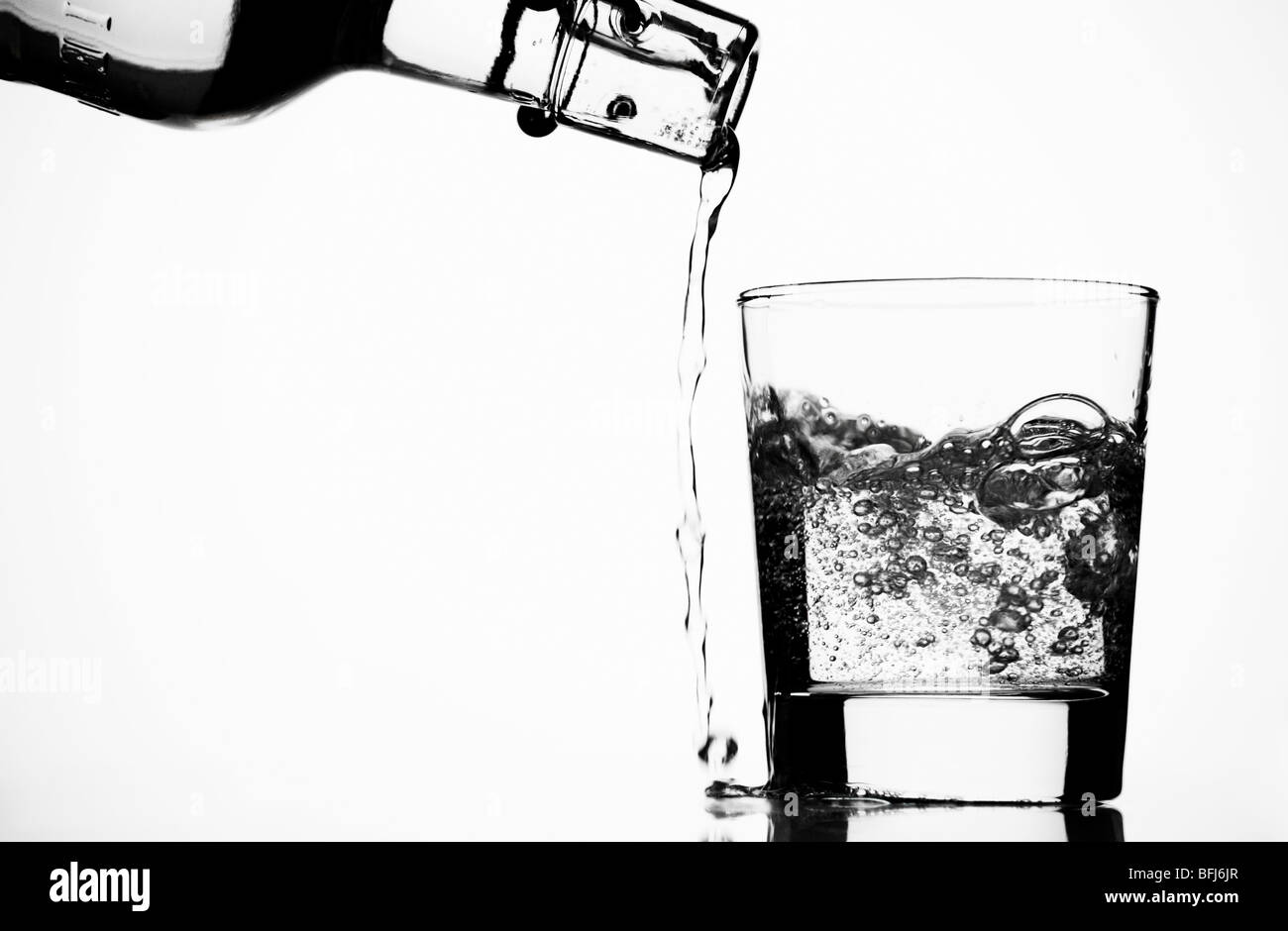 Emptying out a bottle Stock Photo - Alamy