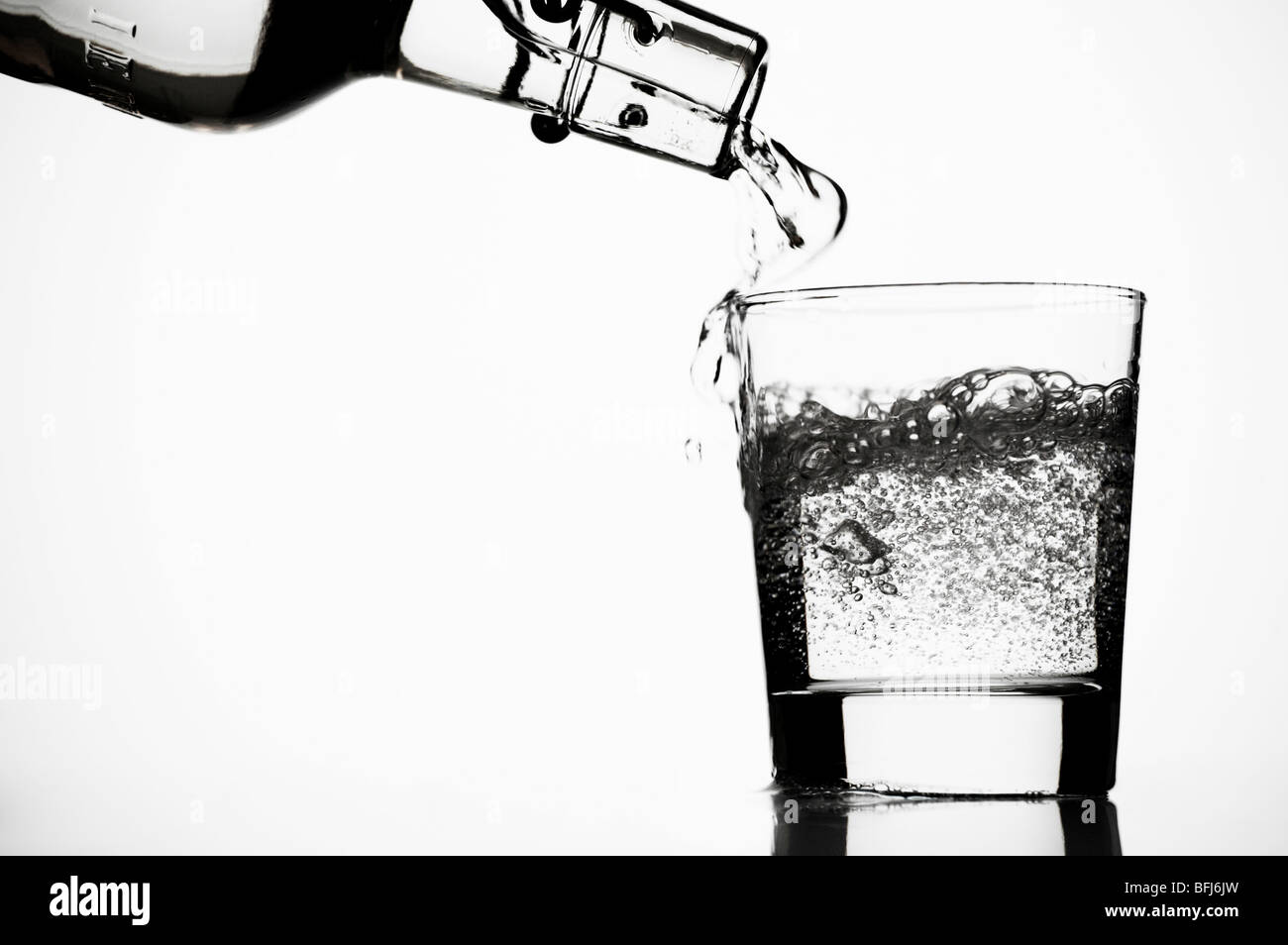 Emptying out a bottle Stock Photo - Alamy