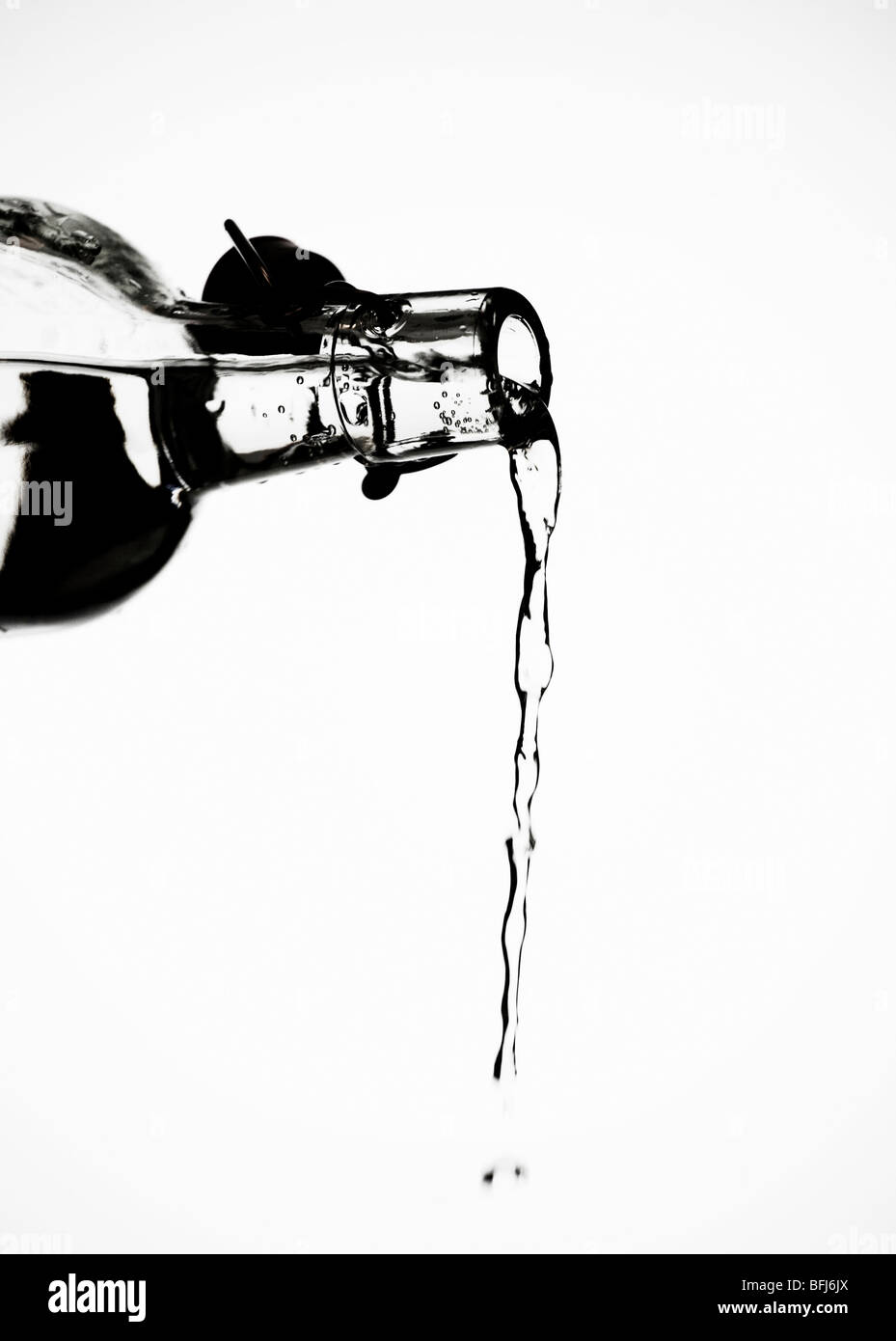 Emptying out a bottle Stock Photo - Alamy