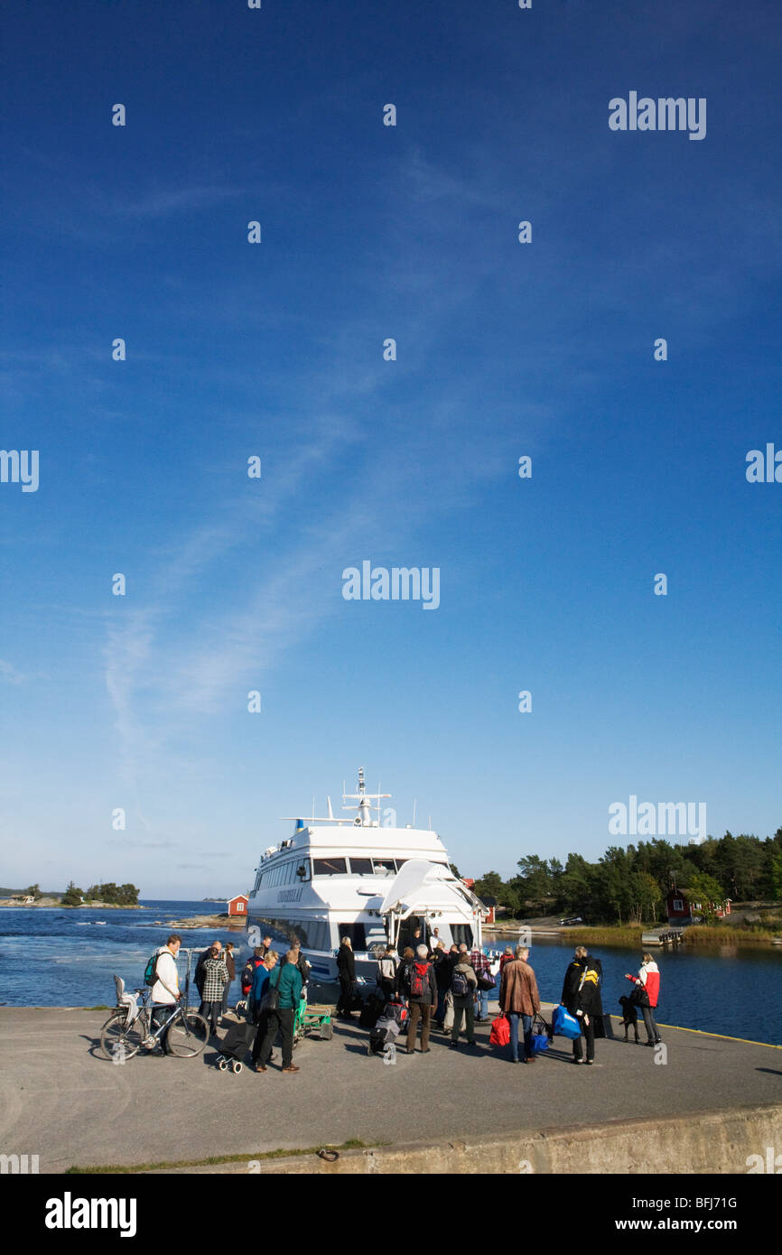 Skerry cruiser by a landing stage, Sweden Stock Photo - Alamy