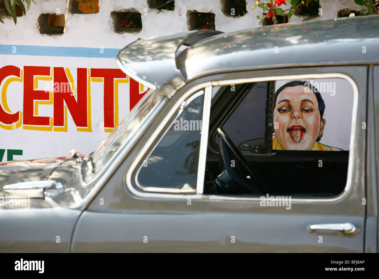 painted face looking through a car window Stock Photo - Alamy