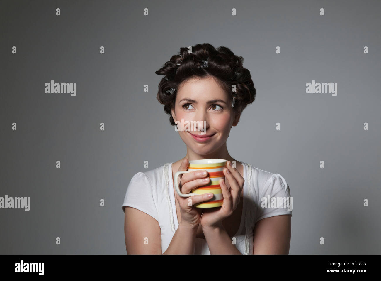 Woman with coy expression hi-res stock photography and images - Alamy