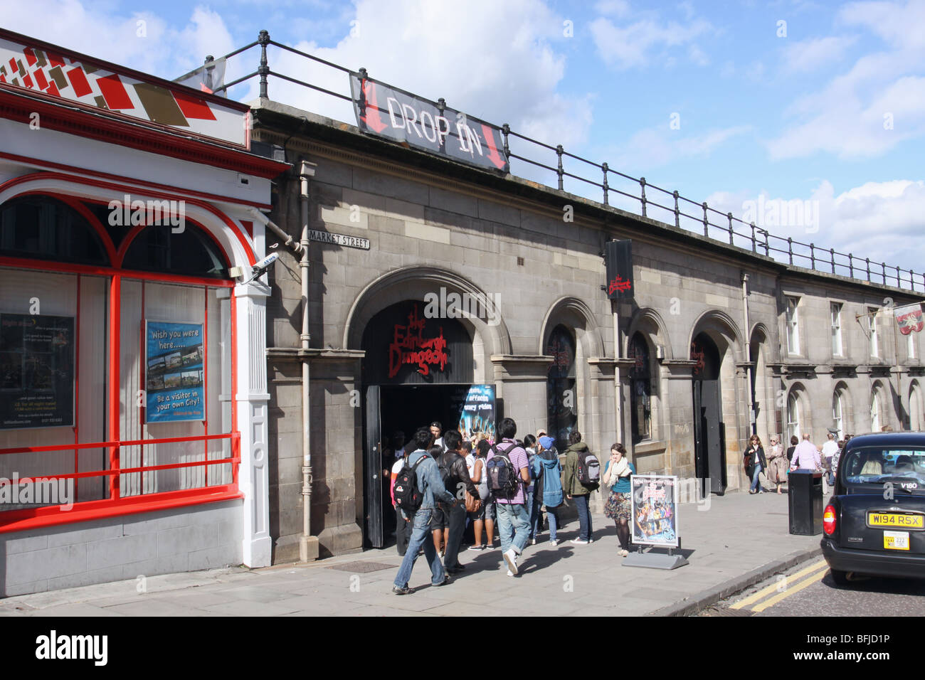 Tourists outside entrance to The Edinburgh Dungeon Scotland August 2009 ...