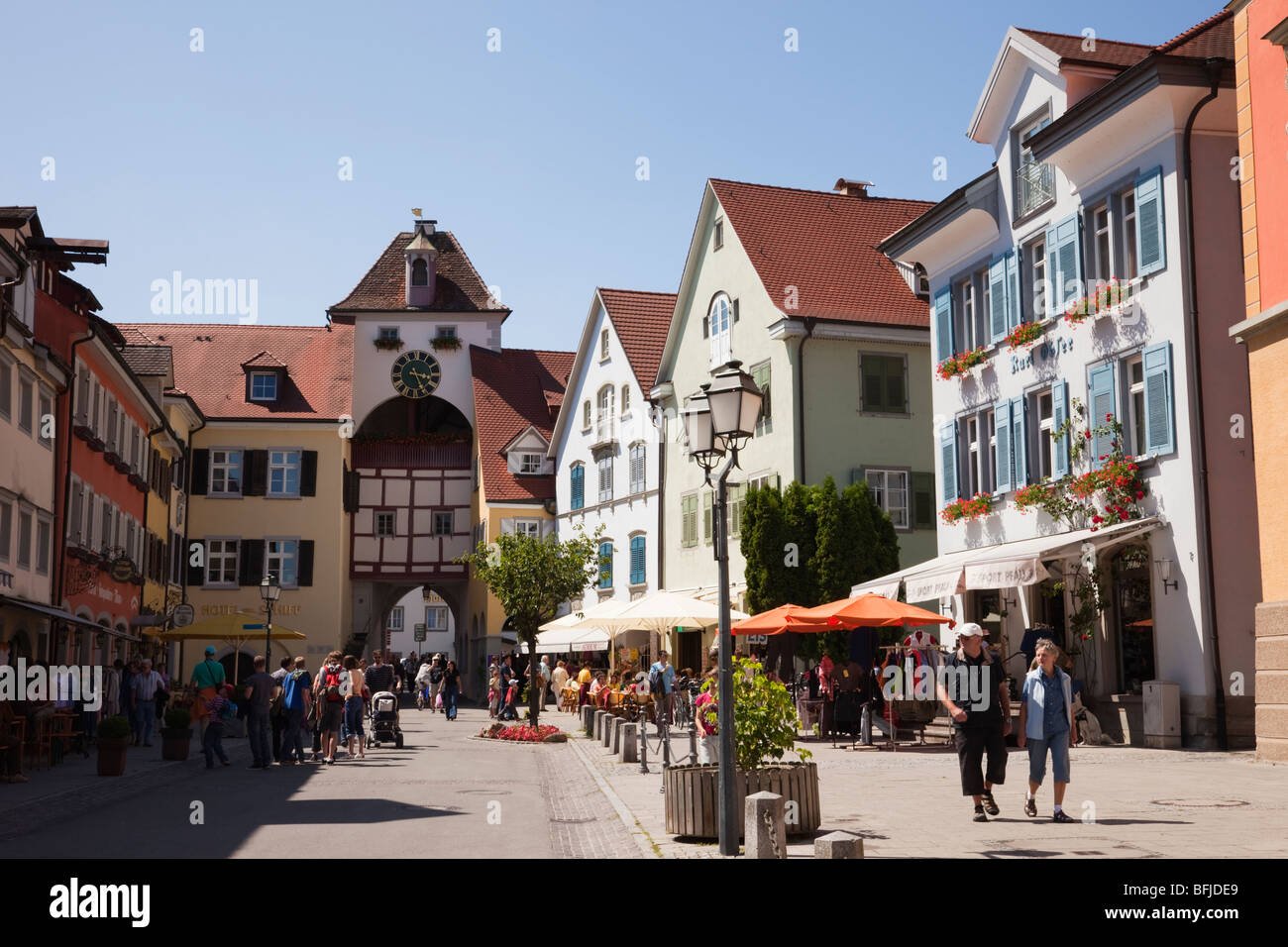 Meersburg Baden-Wurttemberg Germany. Tourists and pavement cafes on cobbled main street by town ...