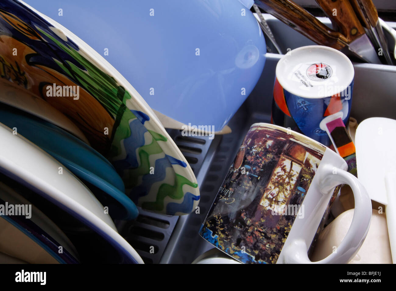 Dishes in drying rack after washing Stock Photo - Alamy