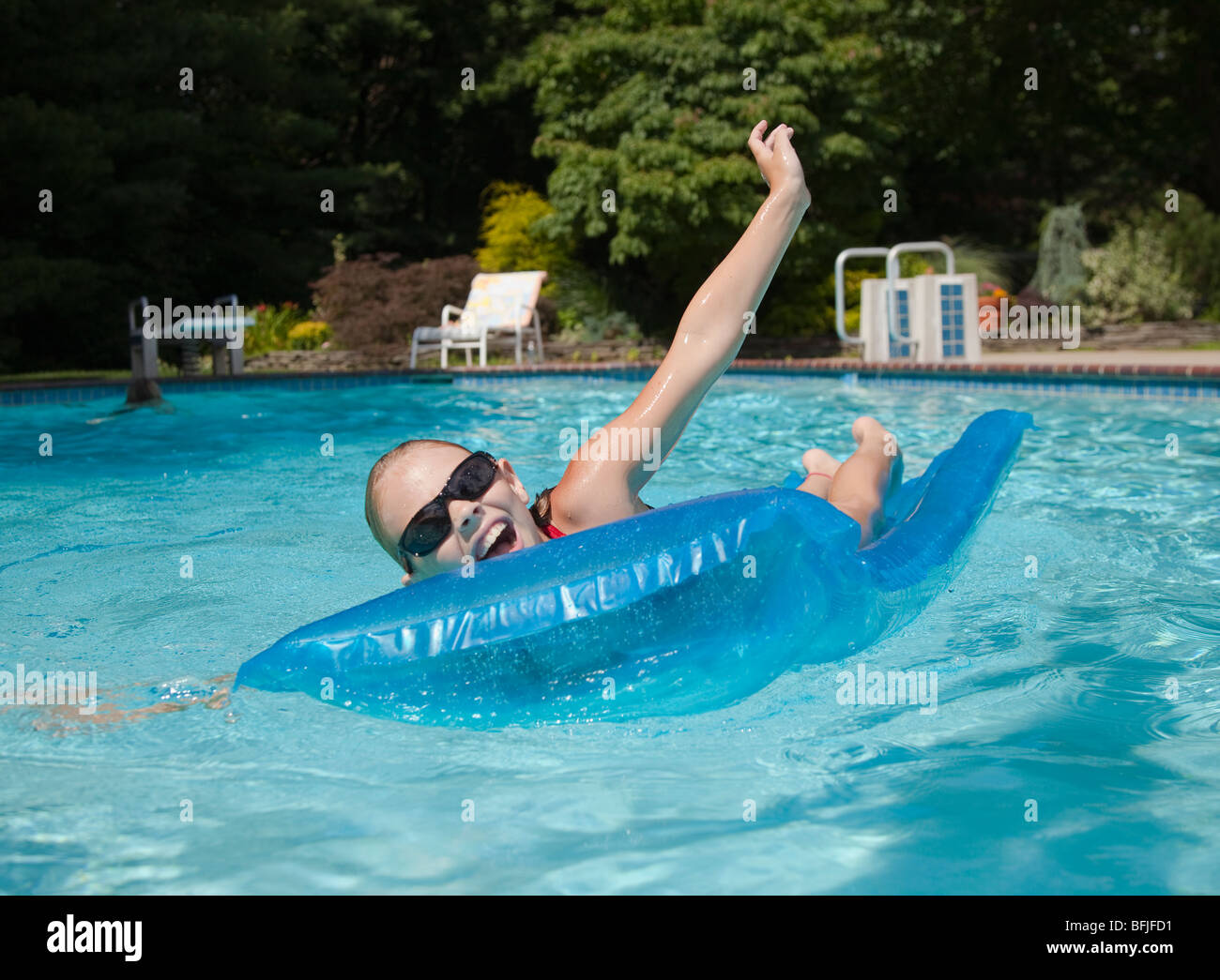 Girl floating in inflatable raft hi-res stock photography and images ...