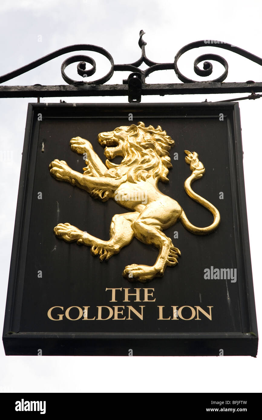 A traditional British pub sign. Many pubs are called the Golden Lion in ...