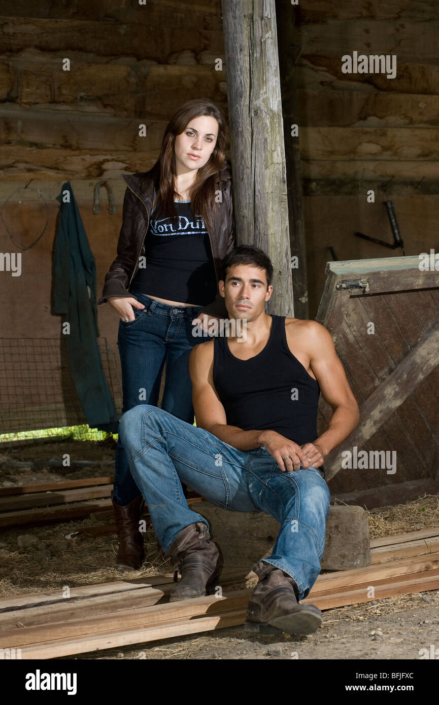 Attractive young couple in a barn Stock Photo - Alamy