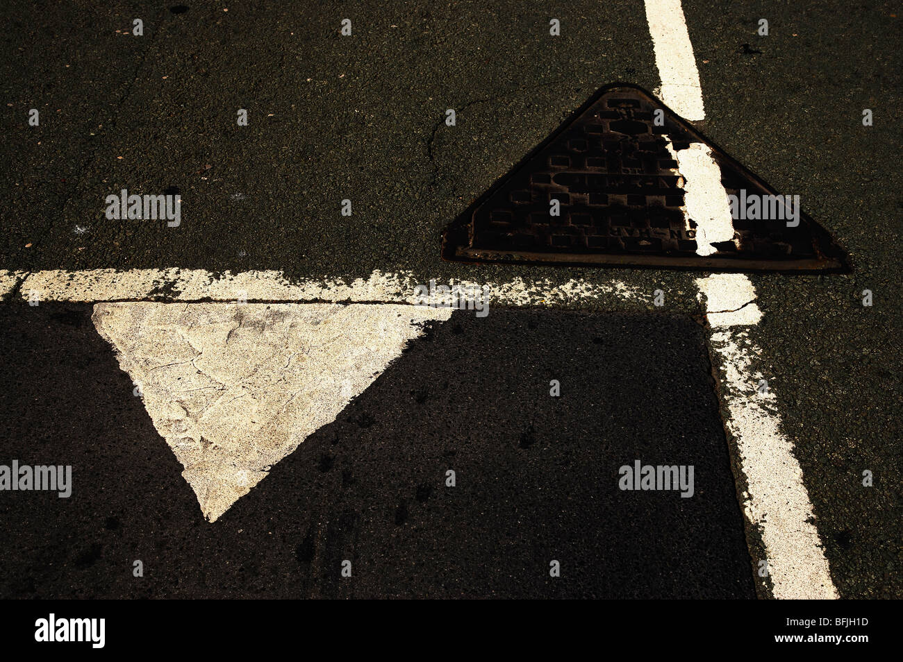 Road markings with manhole Stock Photo - Alamy
