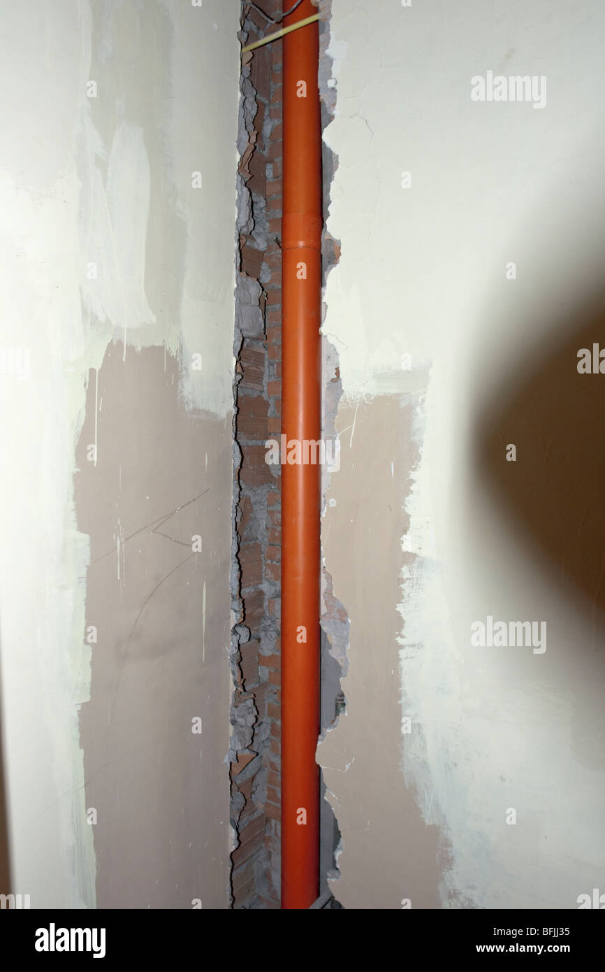 Vertical gutter in orange PVC Stock Photo - Alamy