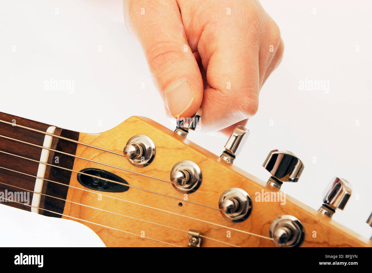 tunning an electric guitar Stock Photo - Alamy