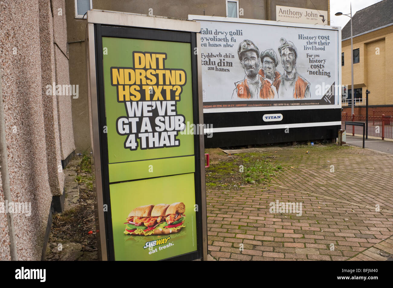 Titan bilingual Welsh English language billboard showing coal miners ...