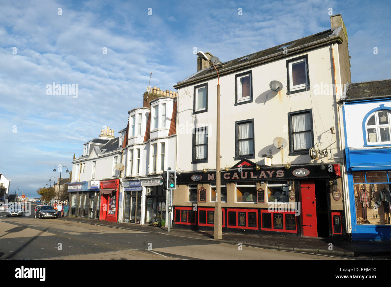 A pub and shops in the seaside town of Largs in Scotland Stock Photo ...