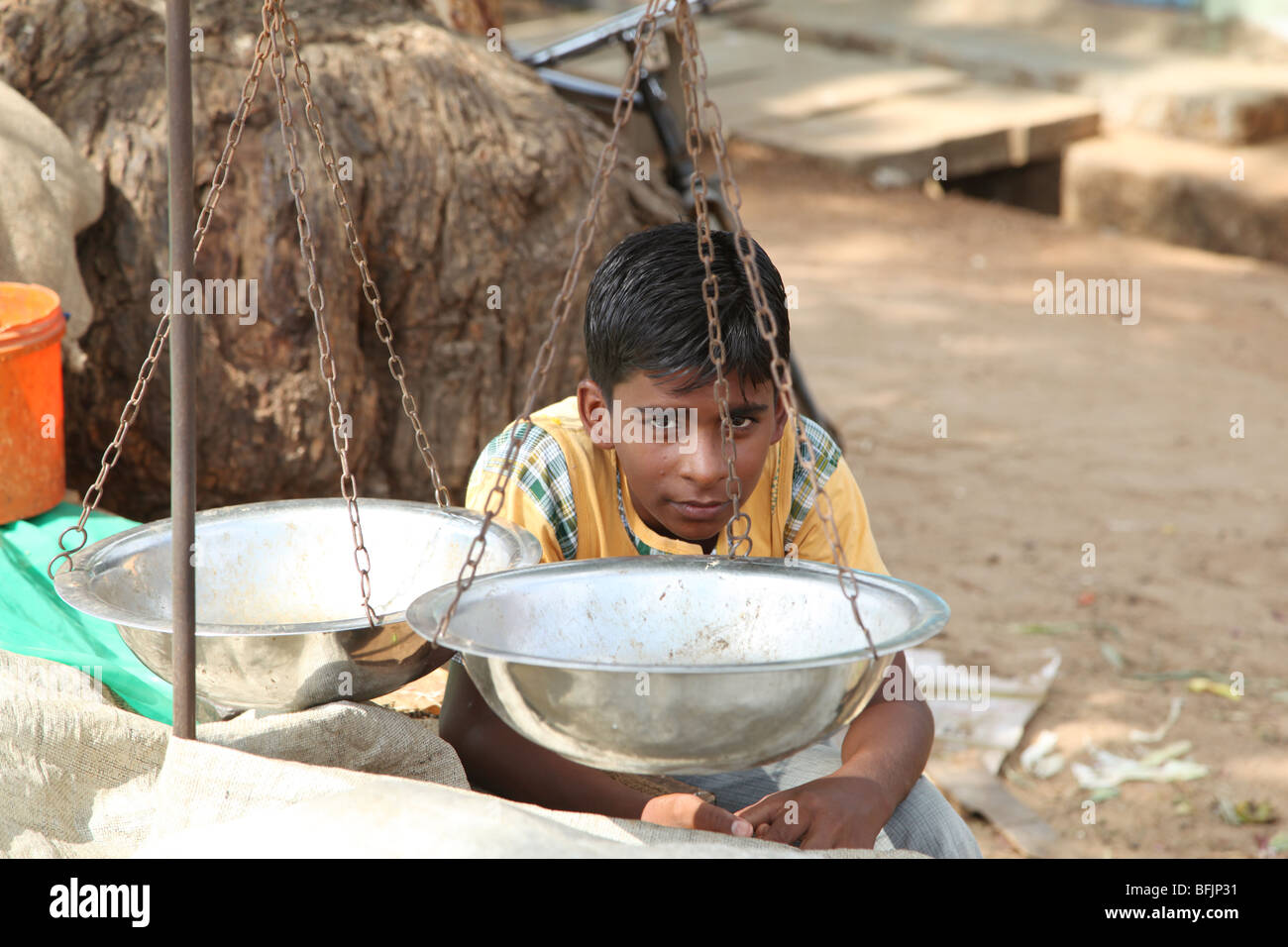 A young boy selling at a street market in Pottuvil, Sri Lanka Stock ...