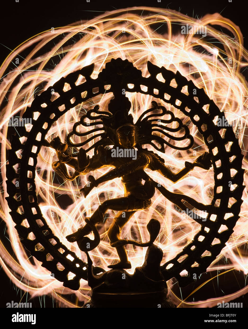 Dancing lord Shiva statue, Nataraja, in front of sparkling cosmic ...