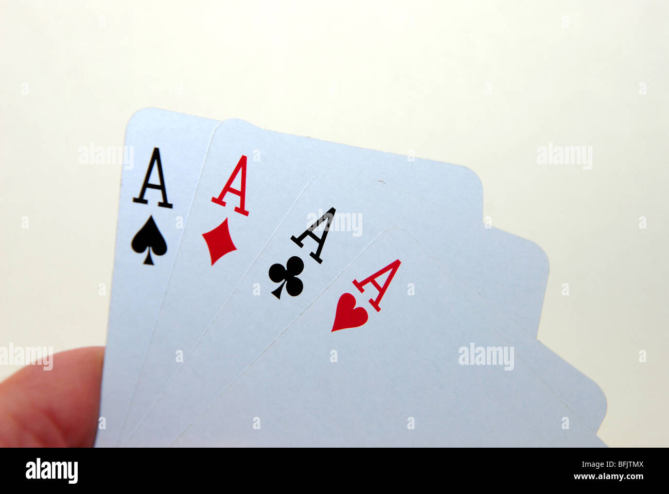 holding all the aces illustrated with a hand of playing cards Stock ...