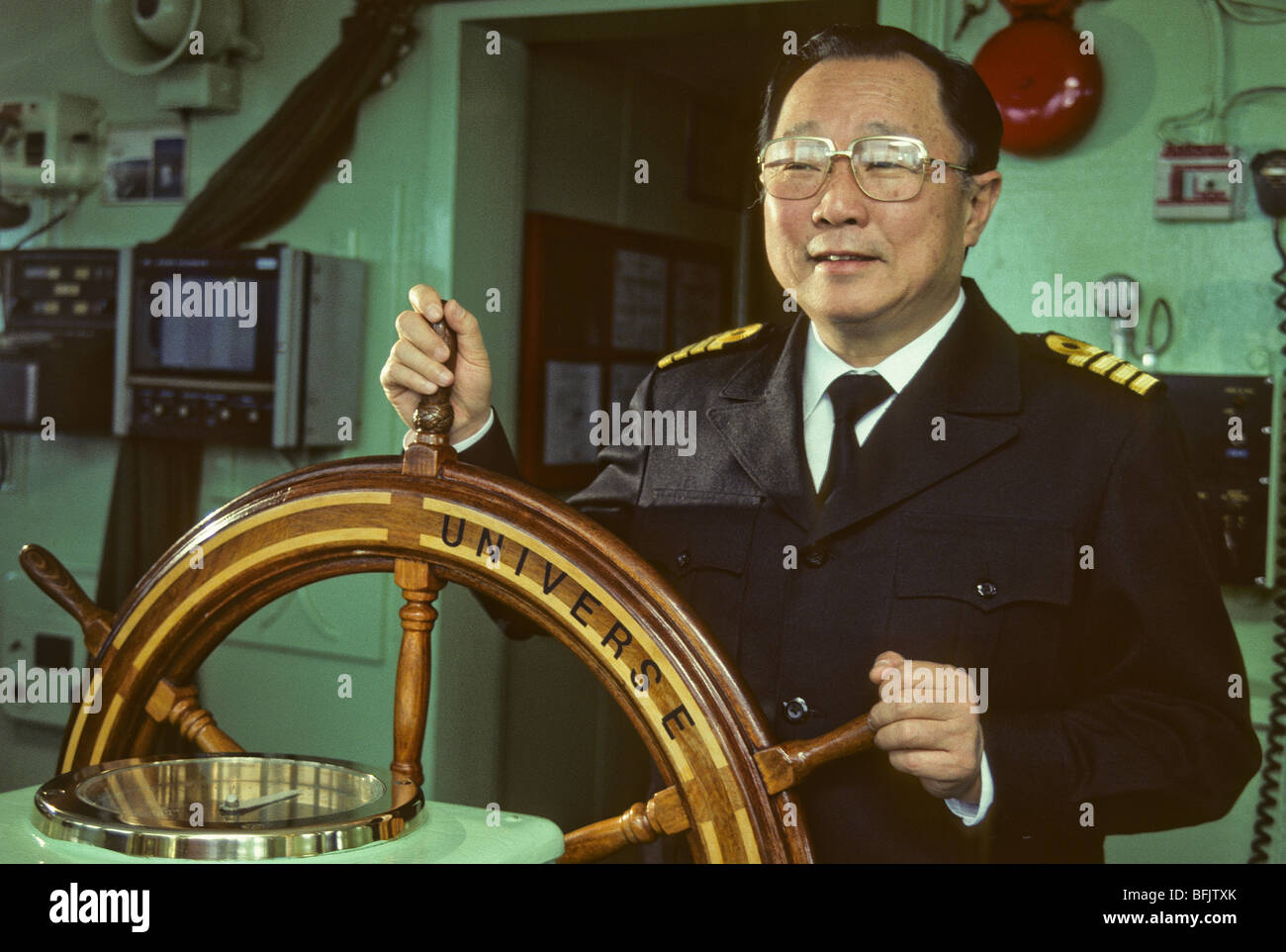 Captain of the SS Universe stands at the helm of the ship Stock Photo ...