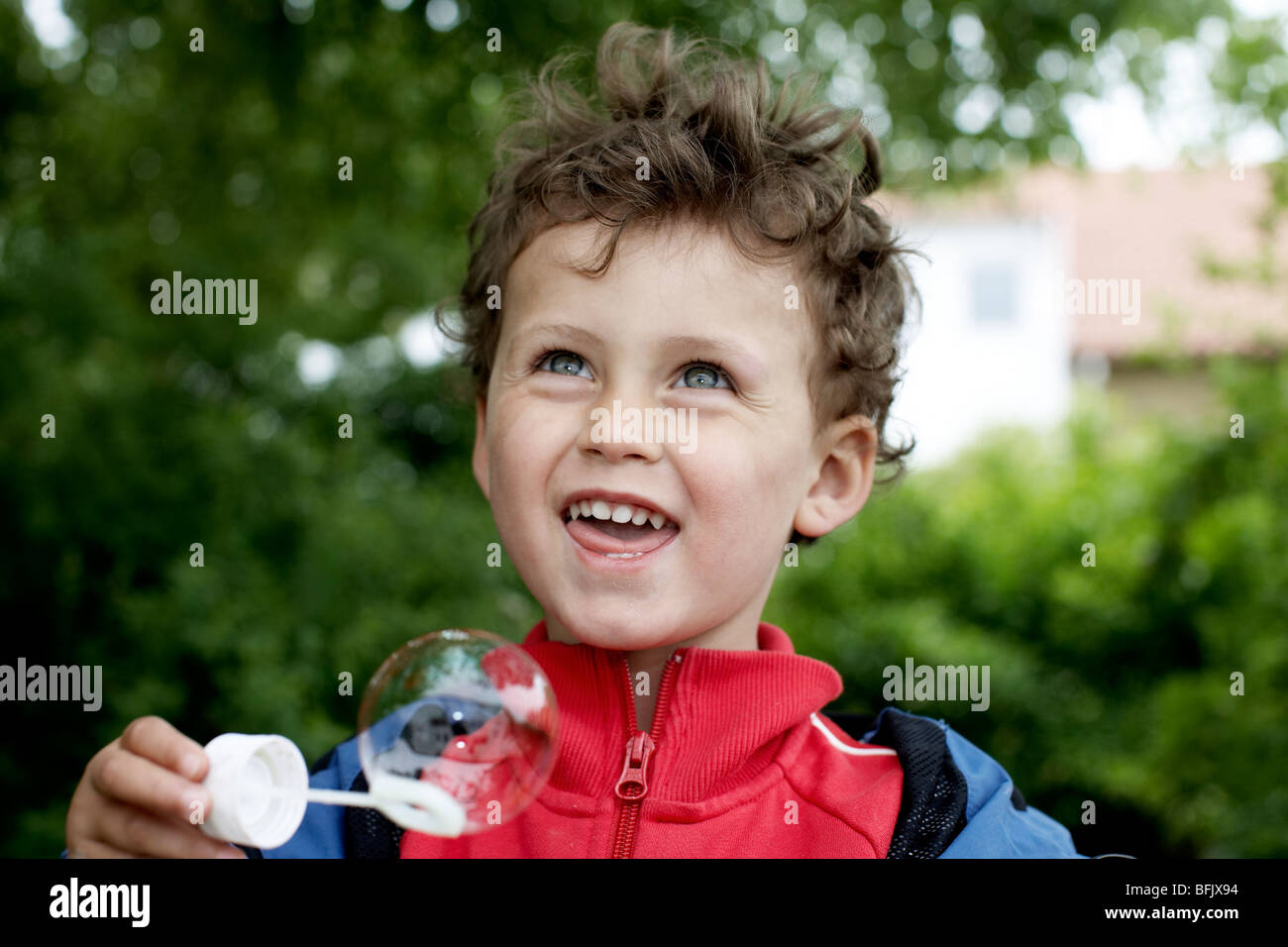 A boy blowing soap bubble Stock Photo - Alamy A boy blowing soap bubble Stock Photo - Alamy