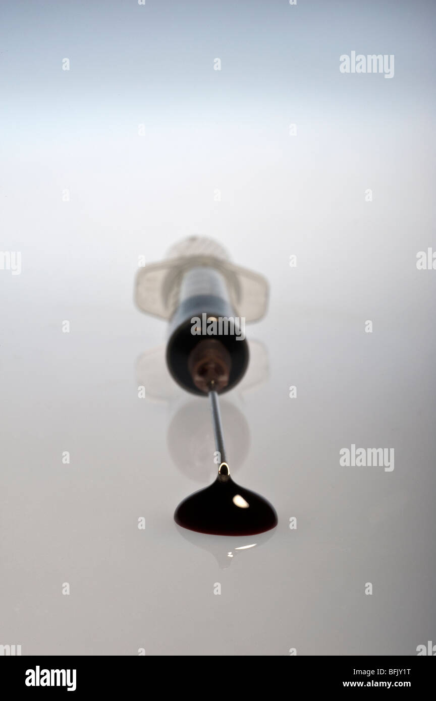 A drop of blood from a syringe Stock Photo - Alamy