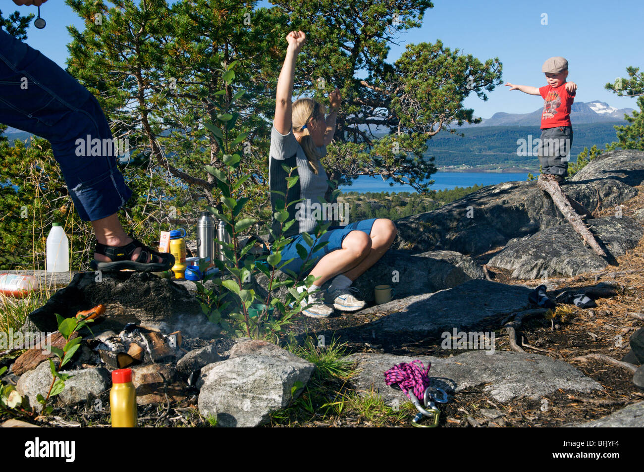 Family playing by a resting place on a rock, Norway Stock Photo - Alamy