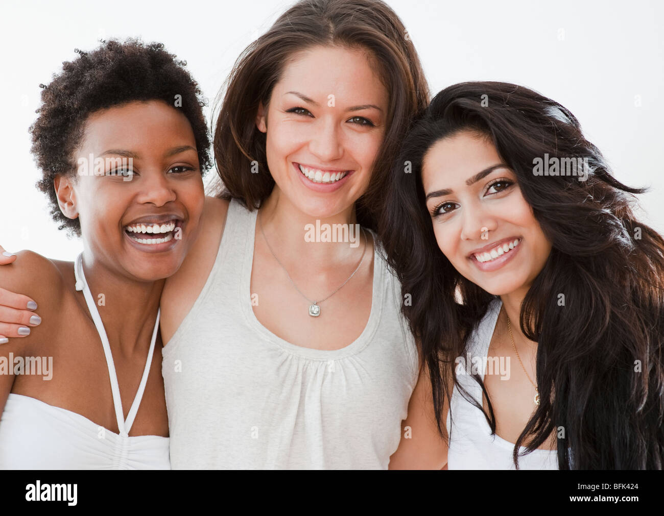 Smiling friends hugging Stock Photo - Alamy