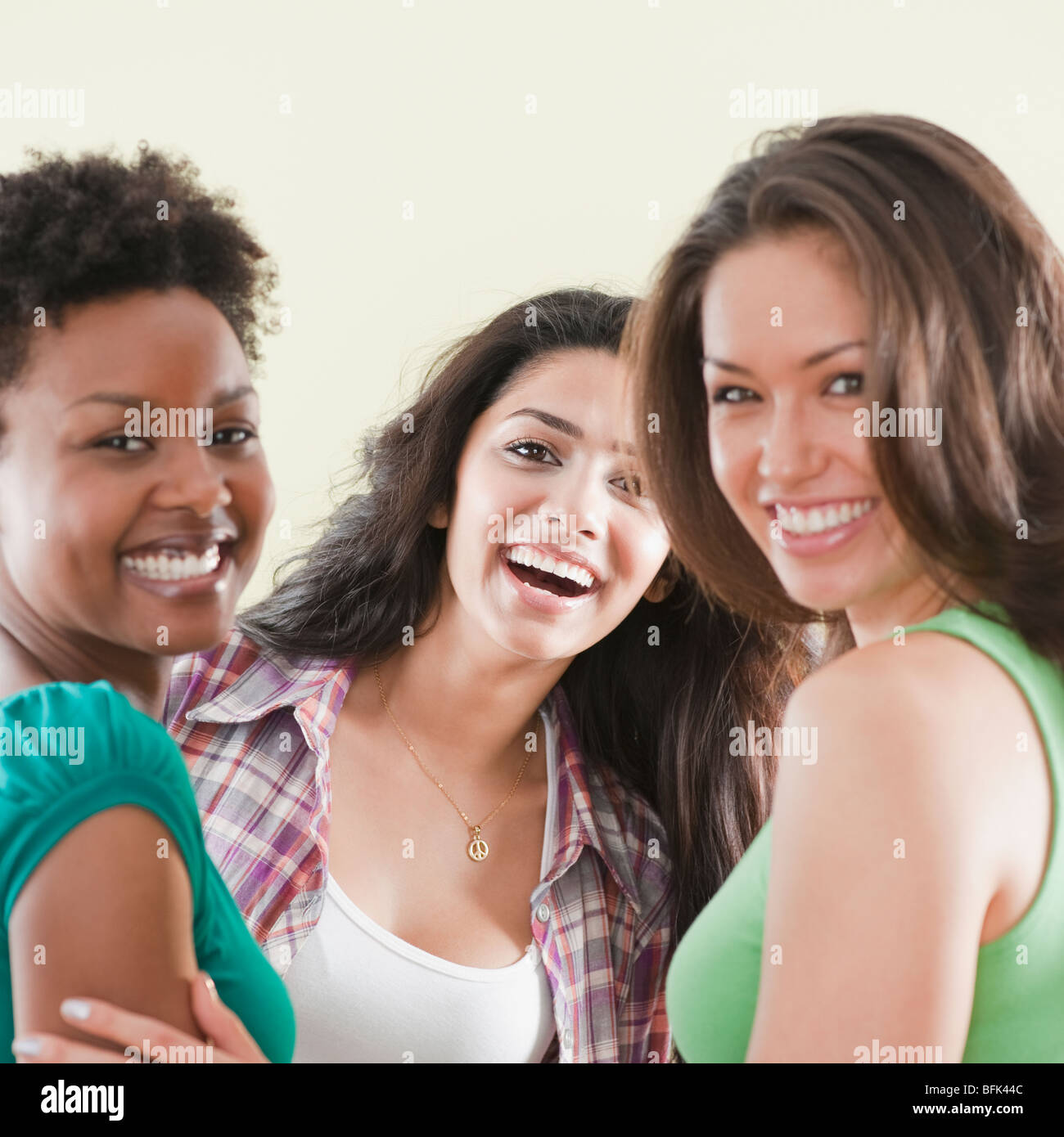 Friends smiling together Stock Photo - Alamy