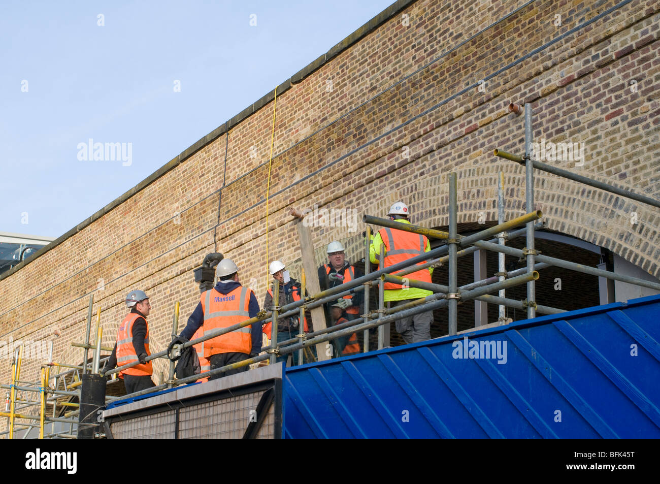 UK. Workers at bridge for new East London Line Overground,Tube station ...