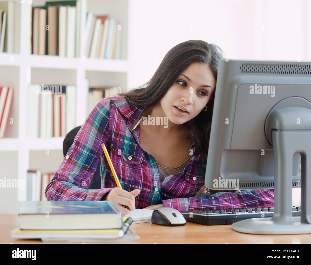 Sitting writing computer monitor technology learning education hi-res ...