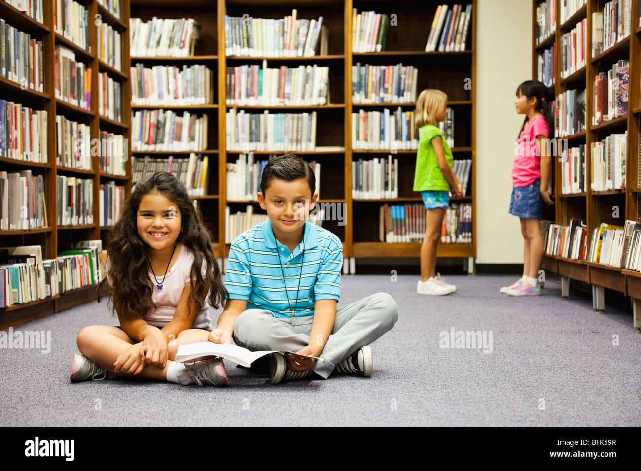 Cross legged girl library hi-res stock photography and images - Alamy